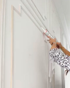 7 Steps to Create a DIY Picture Frame Molding Accent Wall - Brooke ...